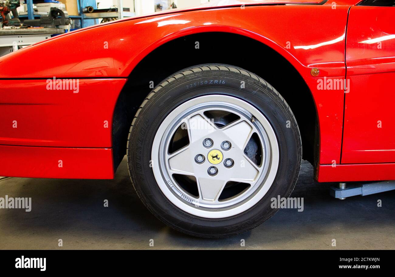 A jacked up Ferrari Testarossa. Here you can see the left fender and ...