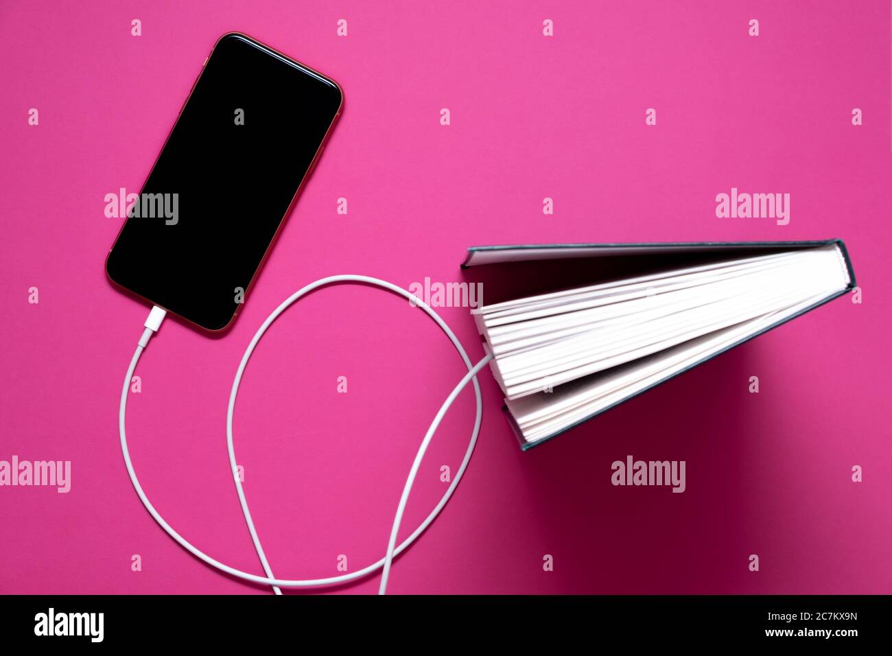 Smart phone connected to the old book with a cable, and download ...