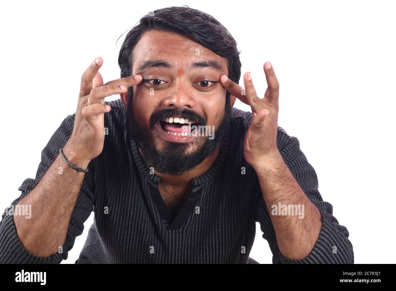 Handsome young man gives Expression and posing isolated on white ...