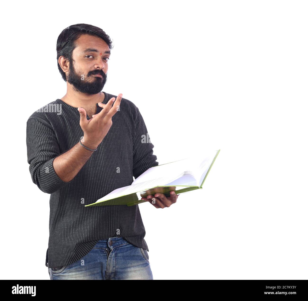 Young man reading or holding a book or diary isolated on white ...
