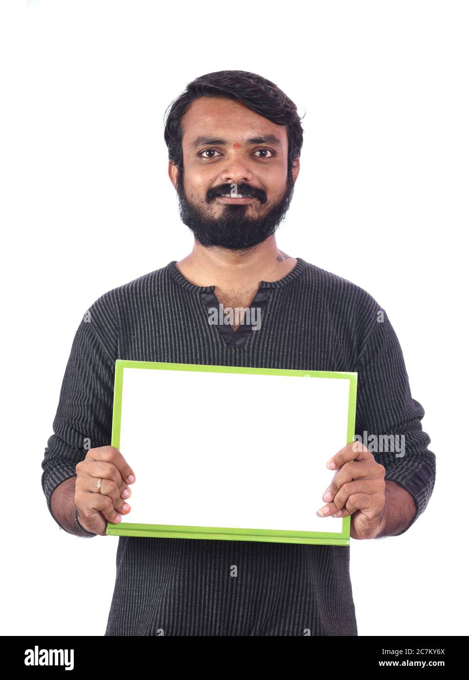 Smiling young man holding board isolated on white background Stock ...