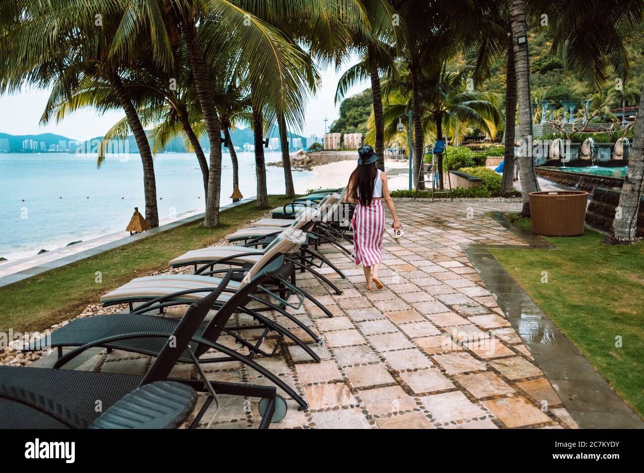 Recreation area on a tropical beach near the sea. Sun loungers for ...