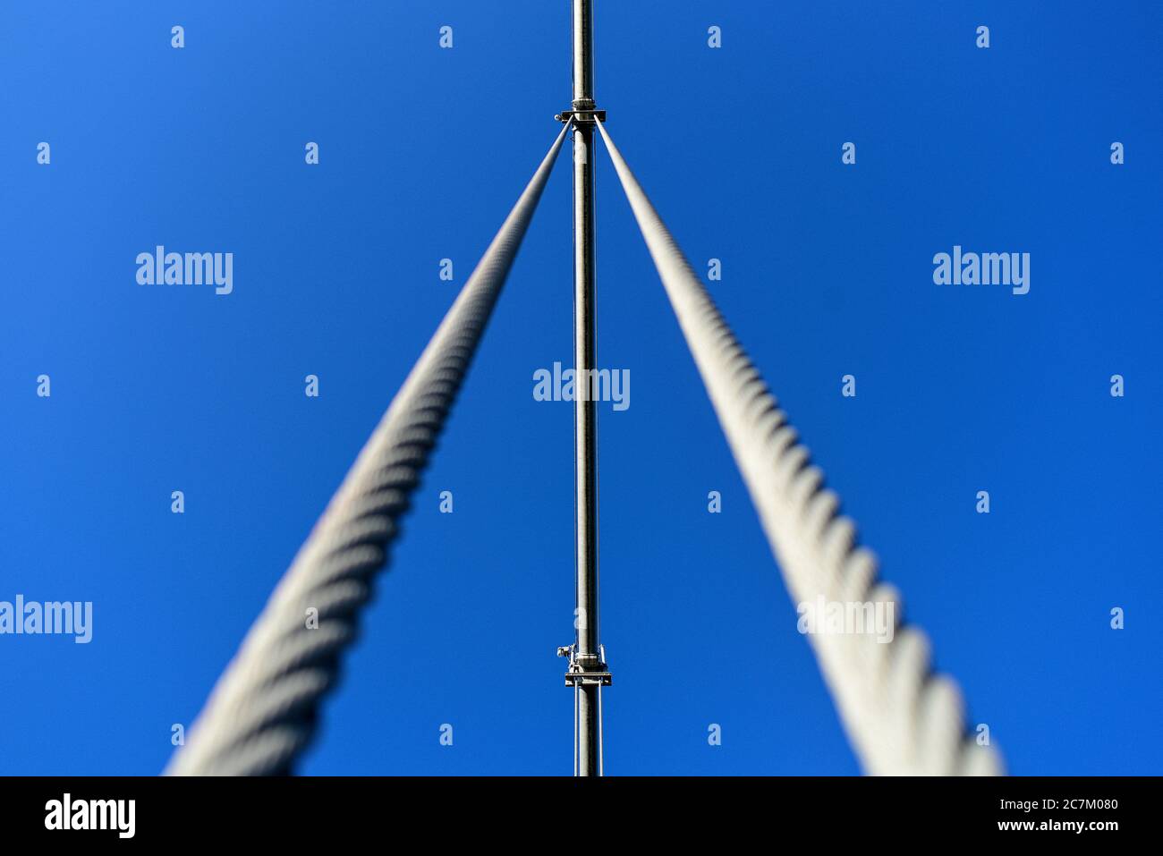 Low angle shot of a mast and rope against a clear blue sky Stock Photo ...