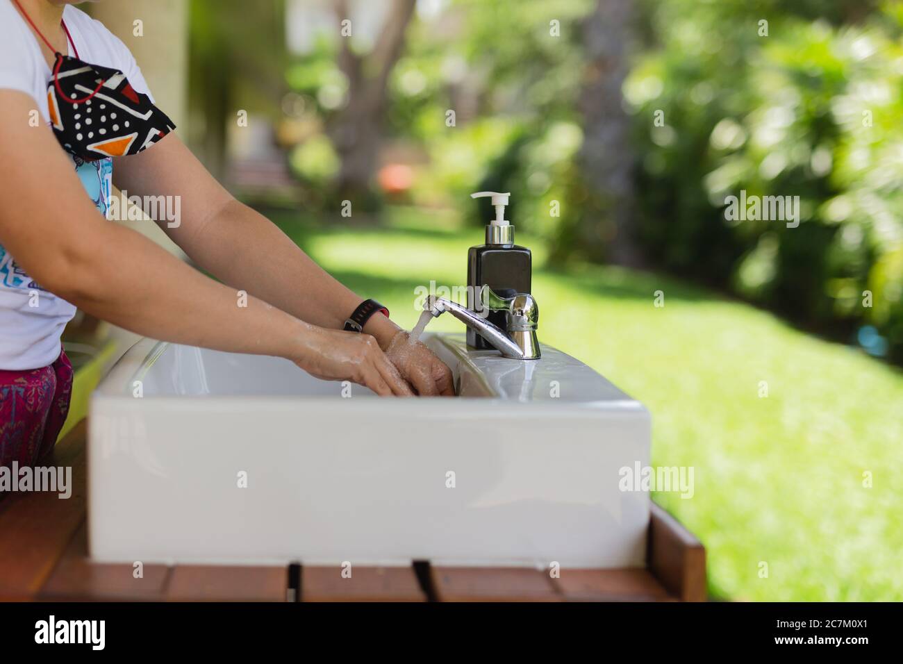 Women washing hands nature hi-res stock photography and images - Alamy
