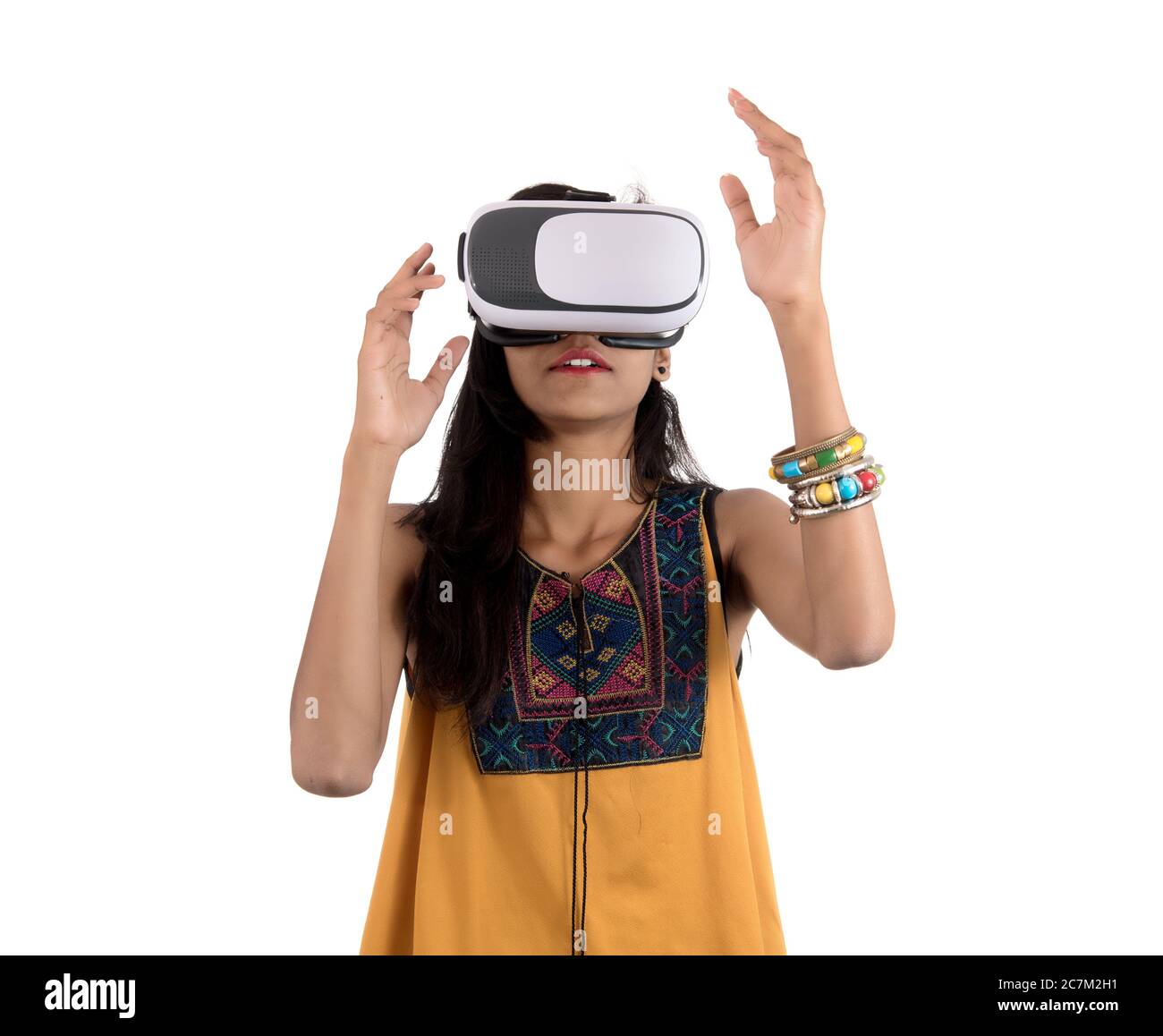 Beautiful girl looking though VR device. Young girl wearing virtual ...