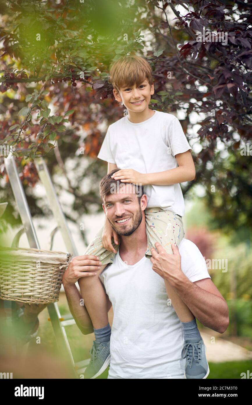 Kid in the shoulders of his father hi-res stock photography and images ...