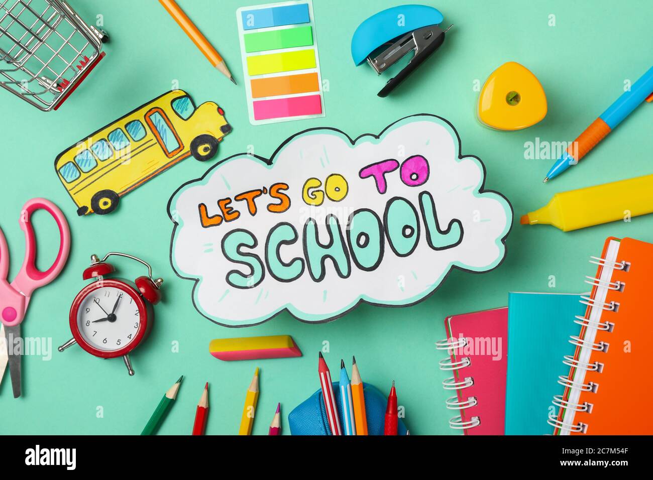Text Let's go to school and school supplies on mint background Stock ...