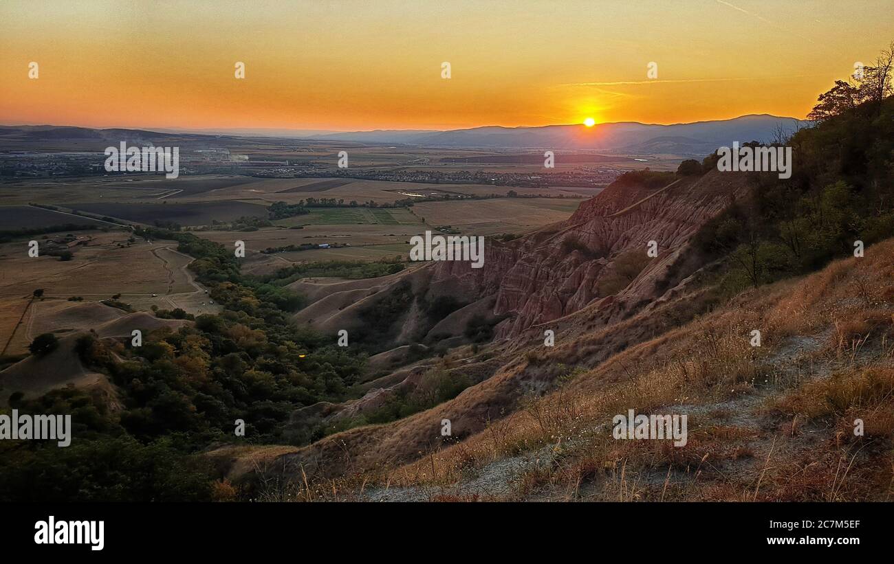 Of sunset with a beautiful overlooking view of a field Stock Photo - Alamy
