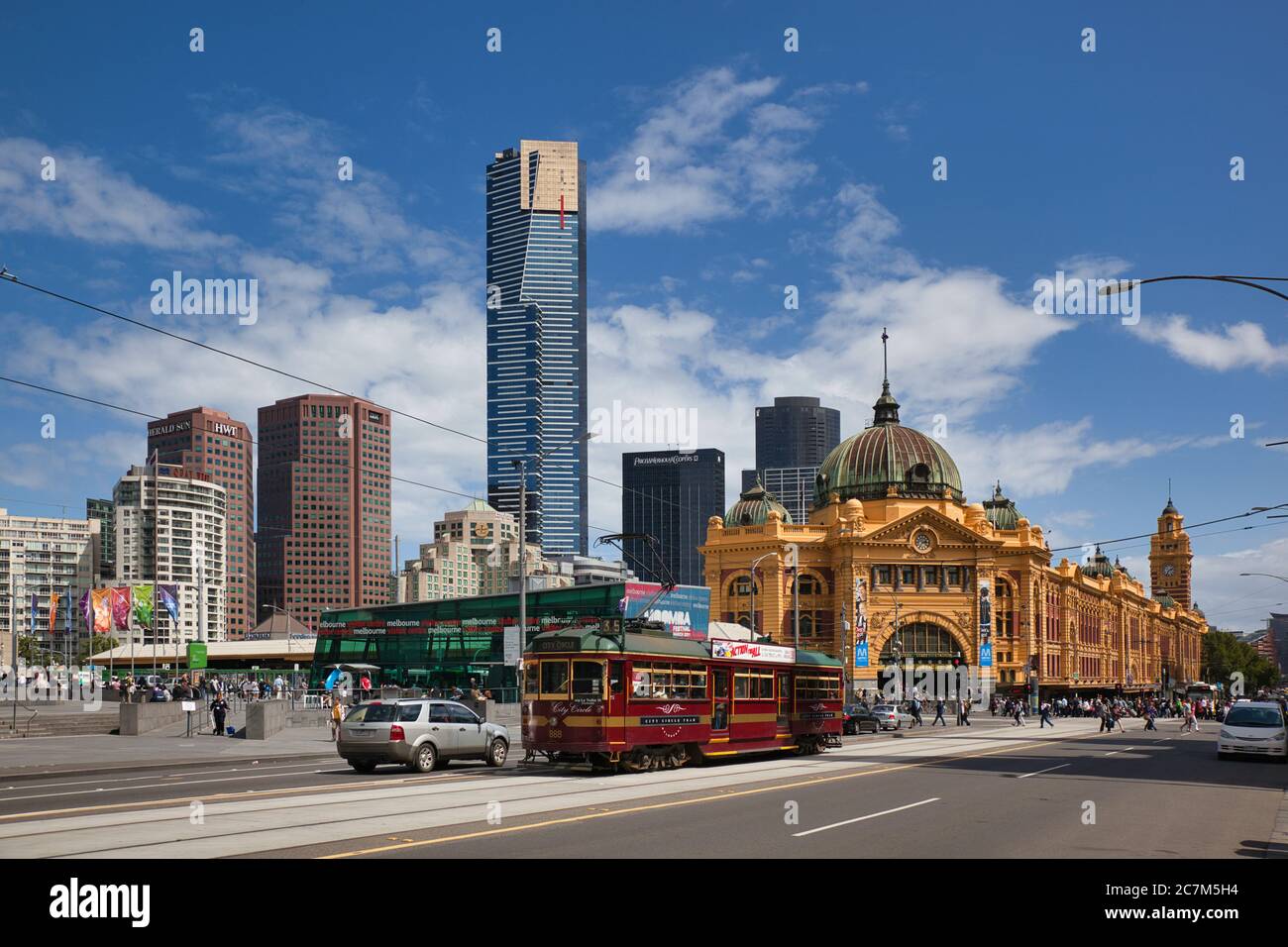 Flinders Street and tram with Flinders Street Station and high rise ...