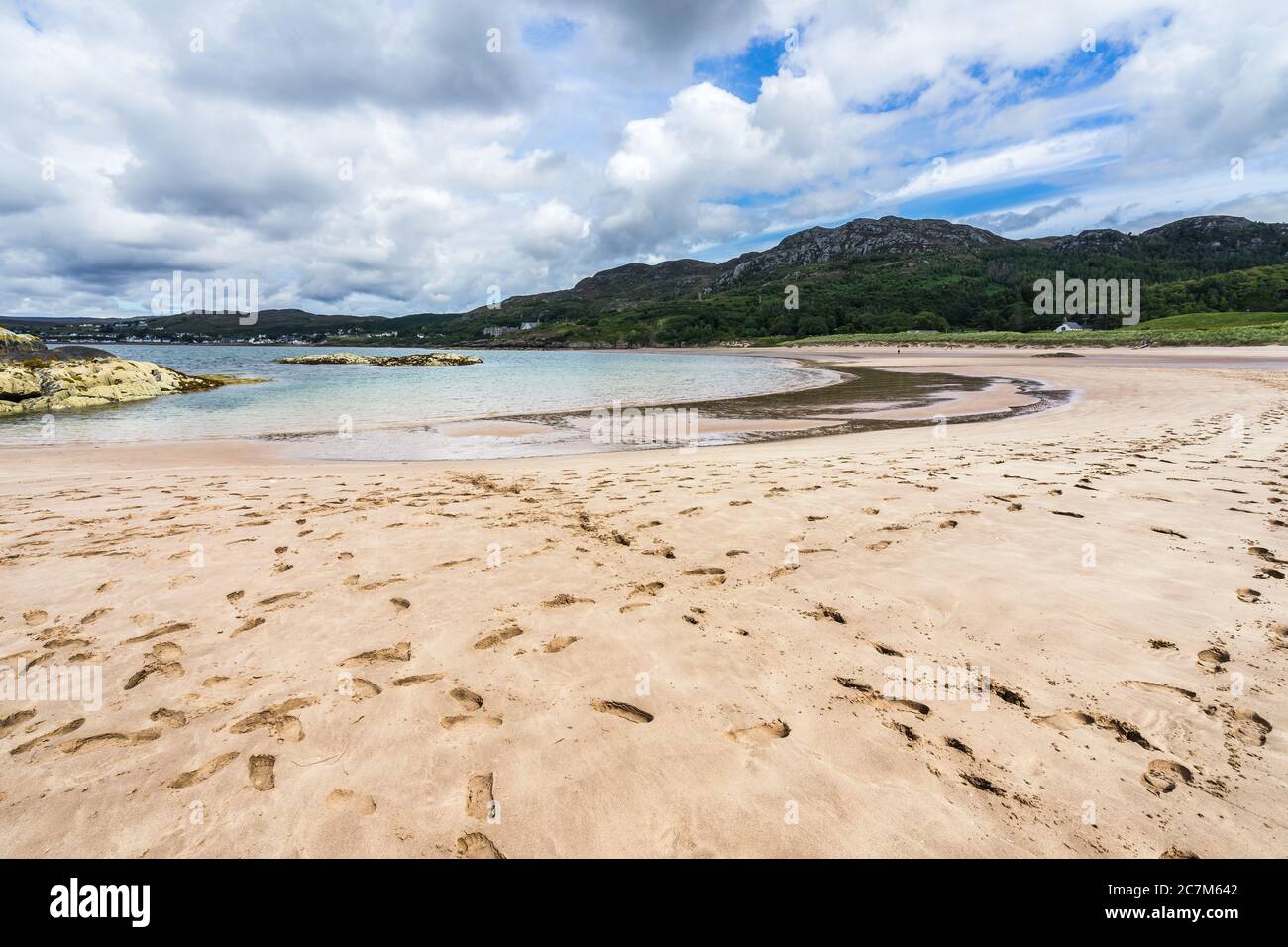 Panoramic shot of the shoreline of Gairloch beach in Scotland with lots ...