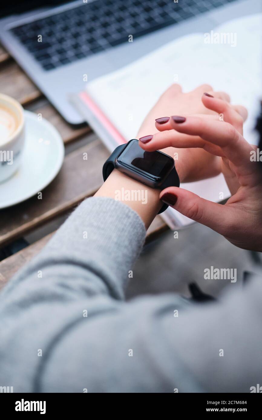 Busy woman checking watch and working hi-res stock photography and ...