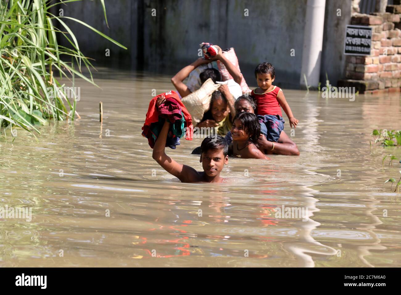 Woman wading through water hi-res stock photography and images - Alamy