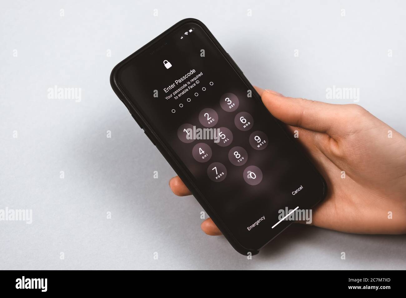 iPhone lock screen on iOS in hand. Password menu Stock Photo - Alamy