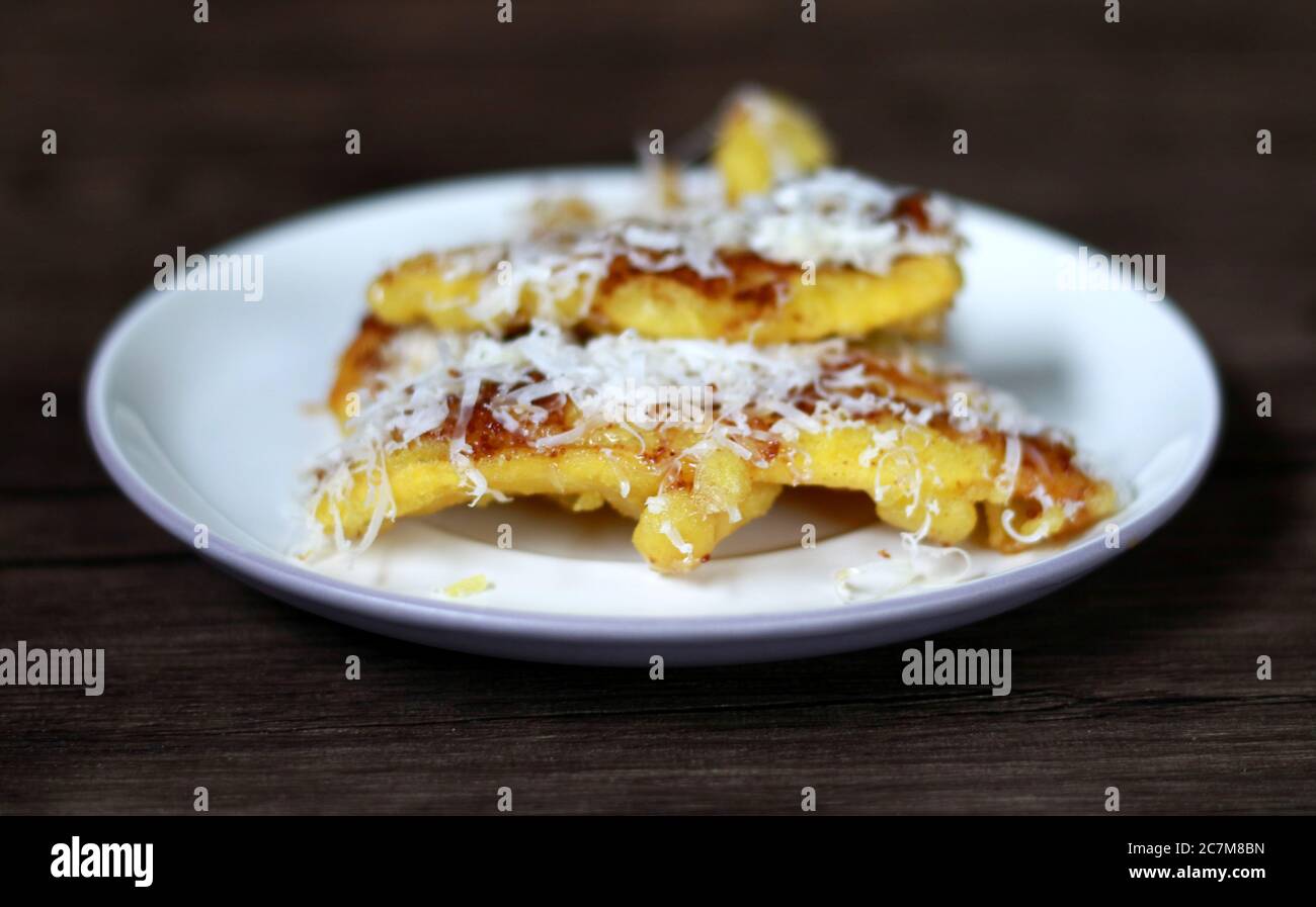Fried banana topping chocolate, milk and cheese. Popular snack in ...