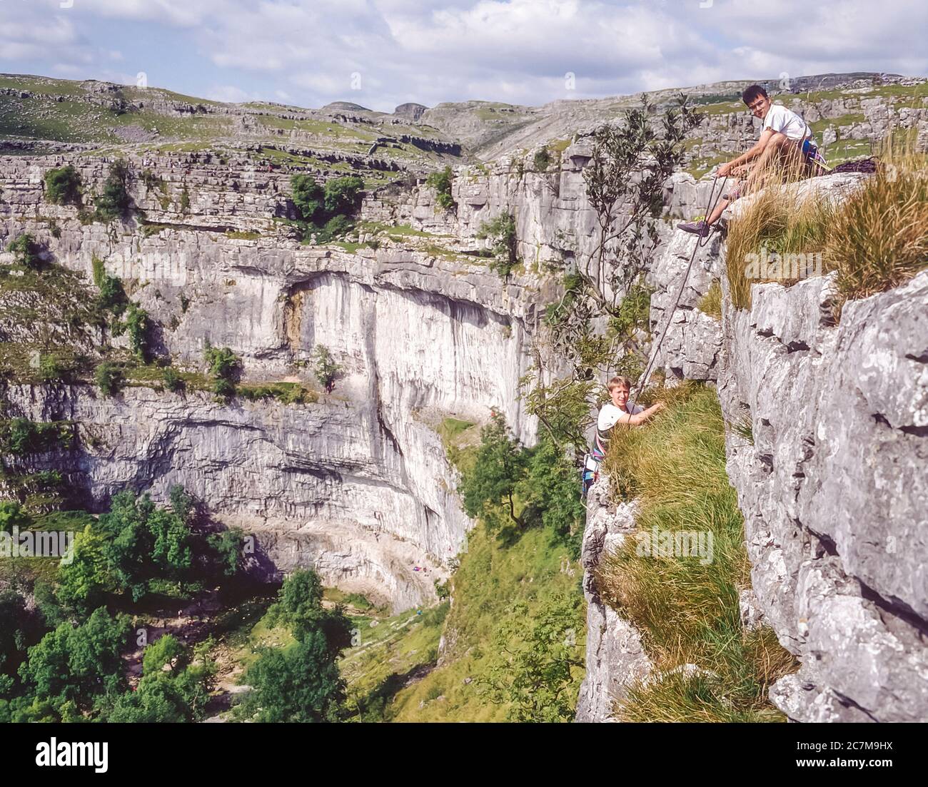 Rock climbers in action at the geological-geographical wonder of Malham ...