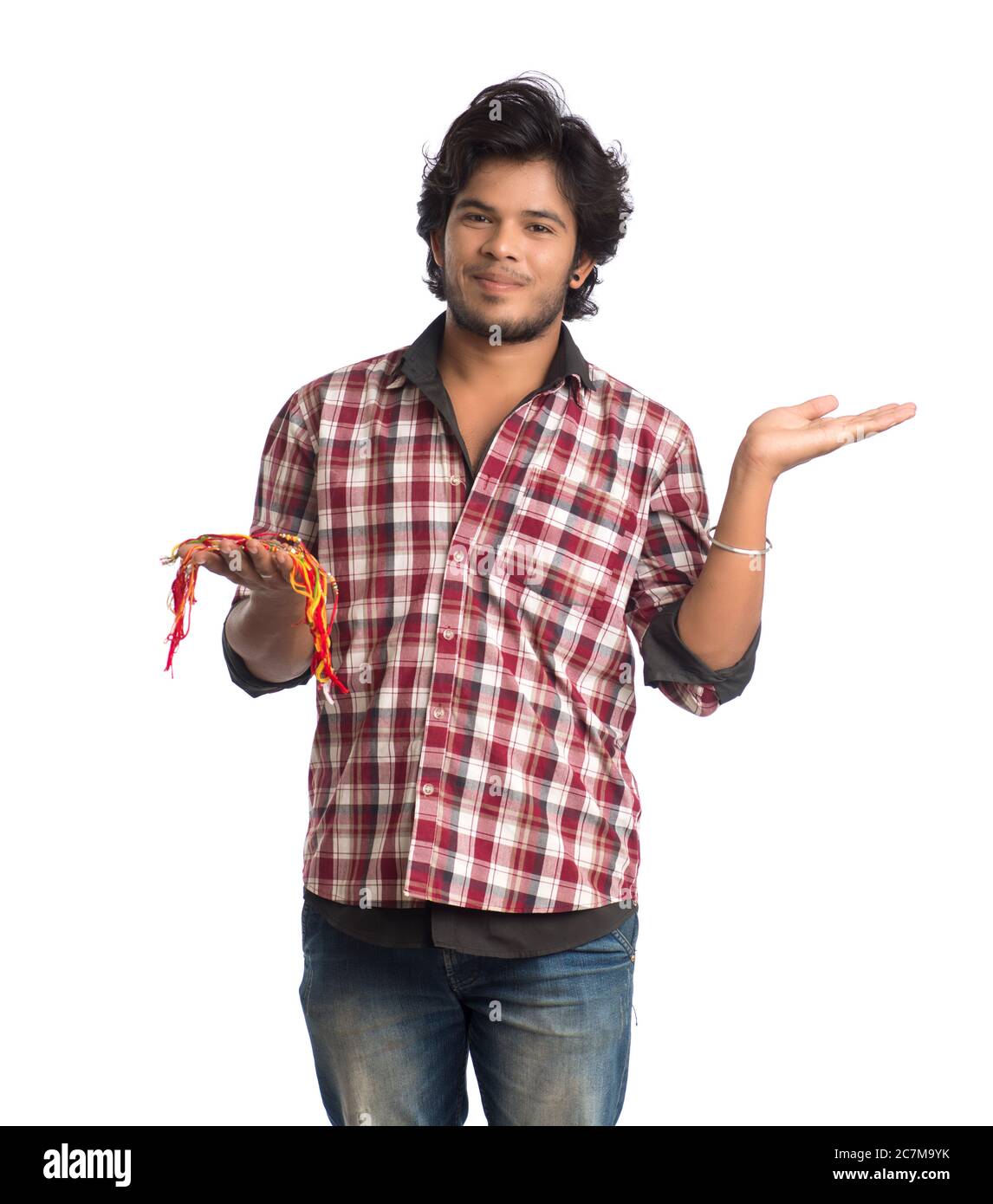 Young men showing rakhi in hand and giving expression on an occasion of ...