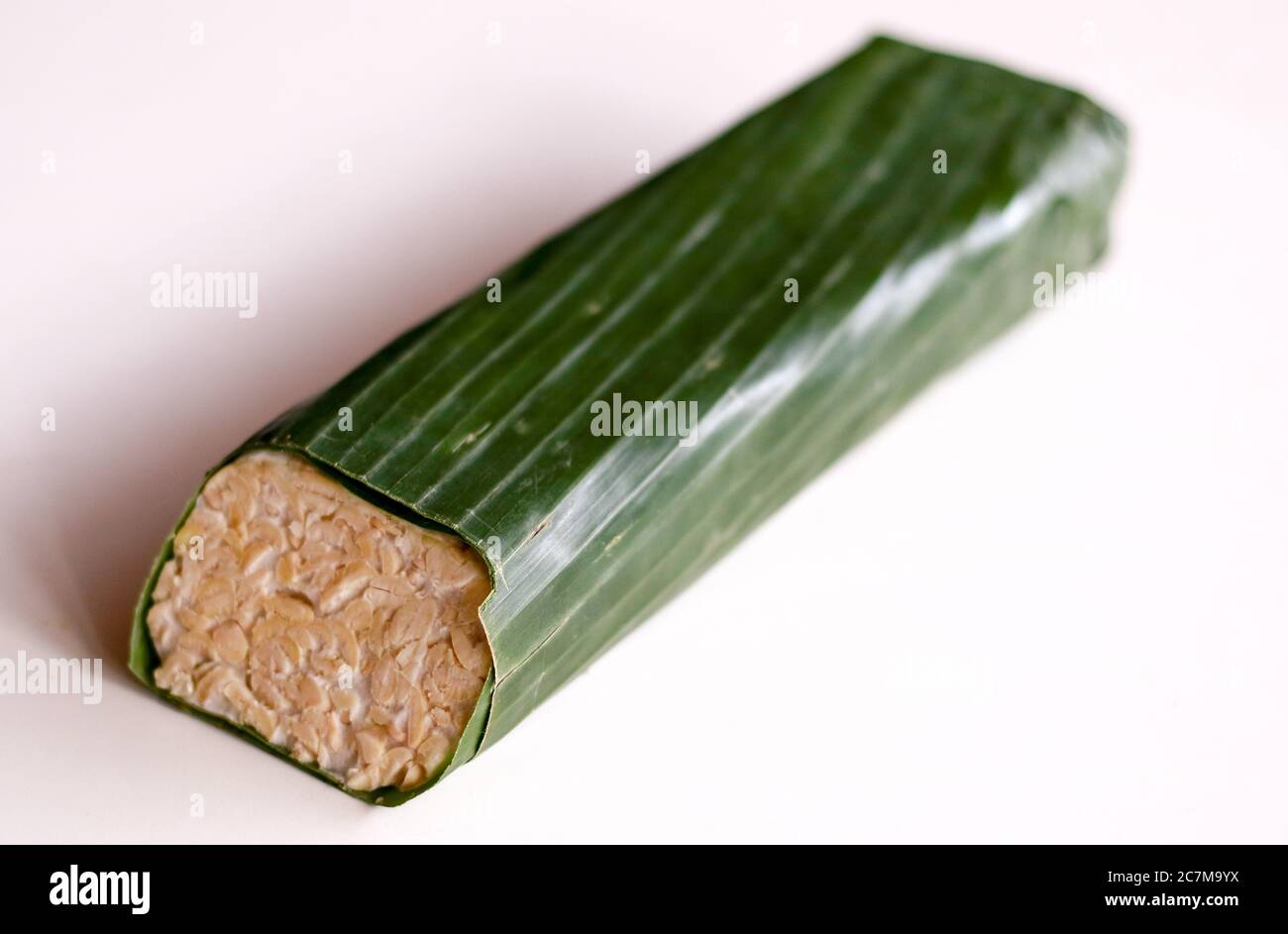 Raw tempeh on white background. Tempeh is a traditional soy product ...