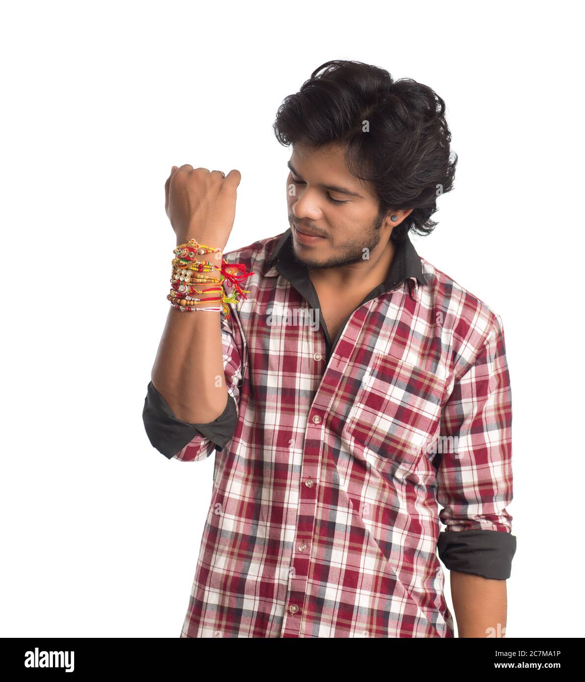 Young men showing rakhi on his hand on an occasion of Raksha Bandhan ...