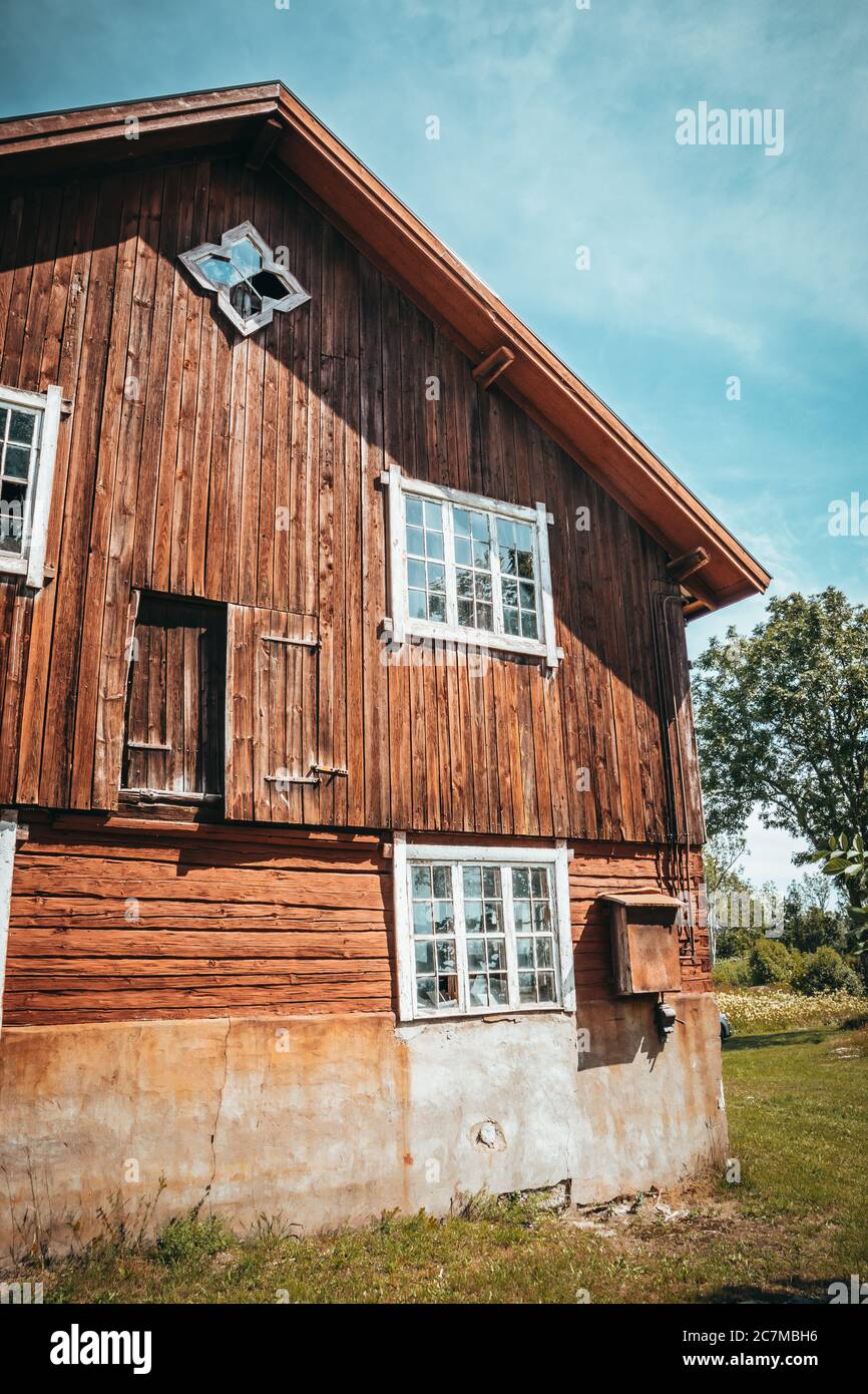 Low angle shot of a big wooden house with outside glass windows Stock ...