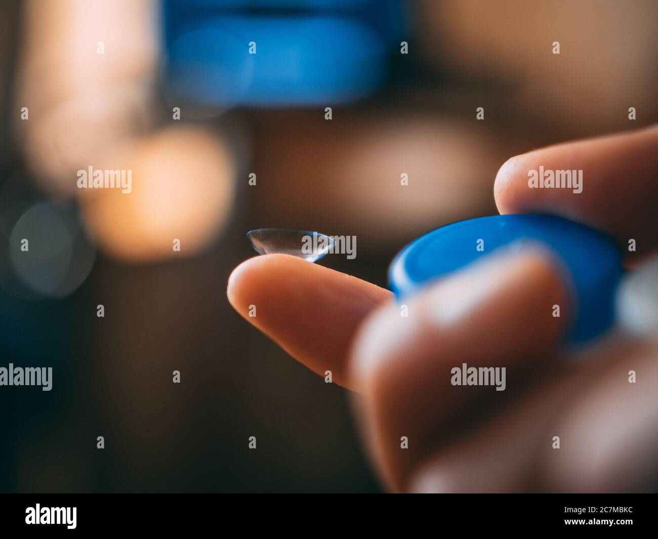Lenses On Finger High Resolution Stock Photography and Images - Alamy