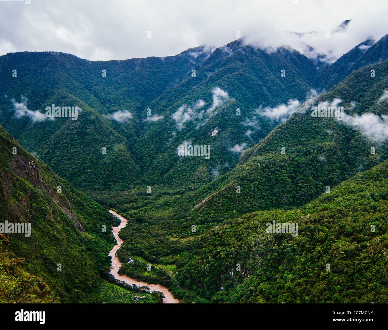 The Urubamba River flowing through the green Andes mountains, Cusco ...