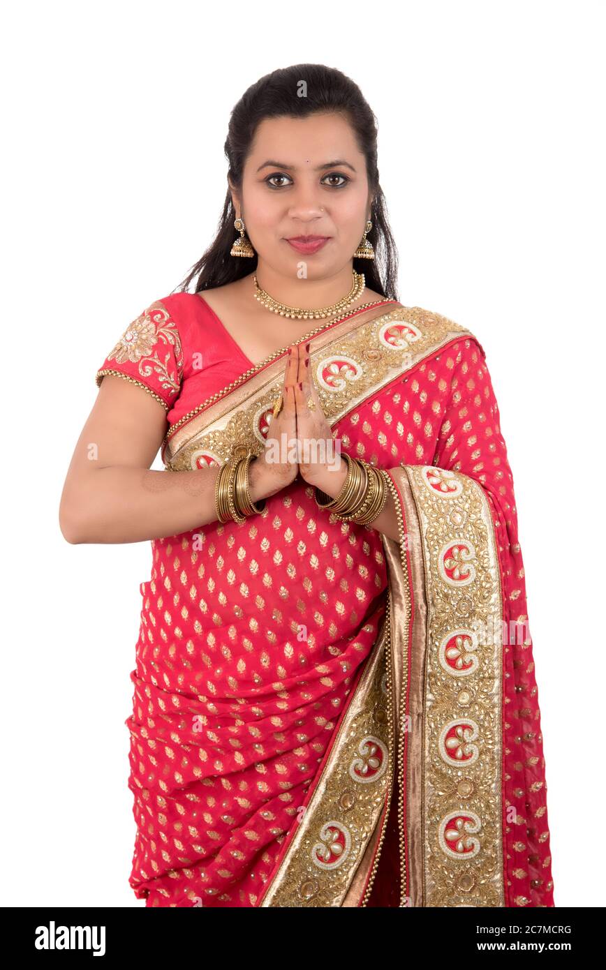 Beautiful Indian girl in a tradition sari with welcome expression ...