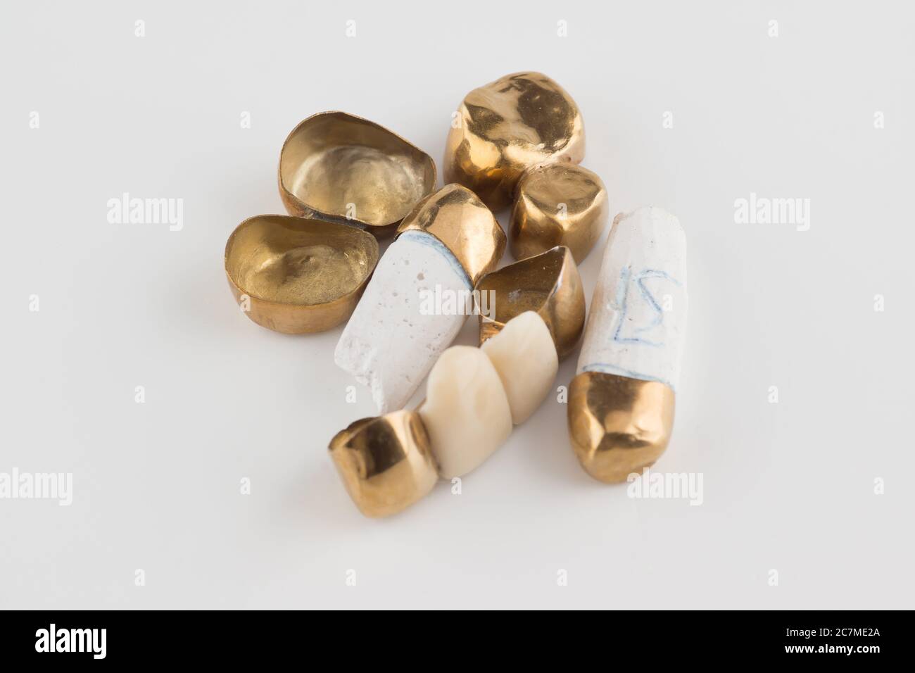 stamped brazed dental bridges covered with gold coated on white ...