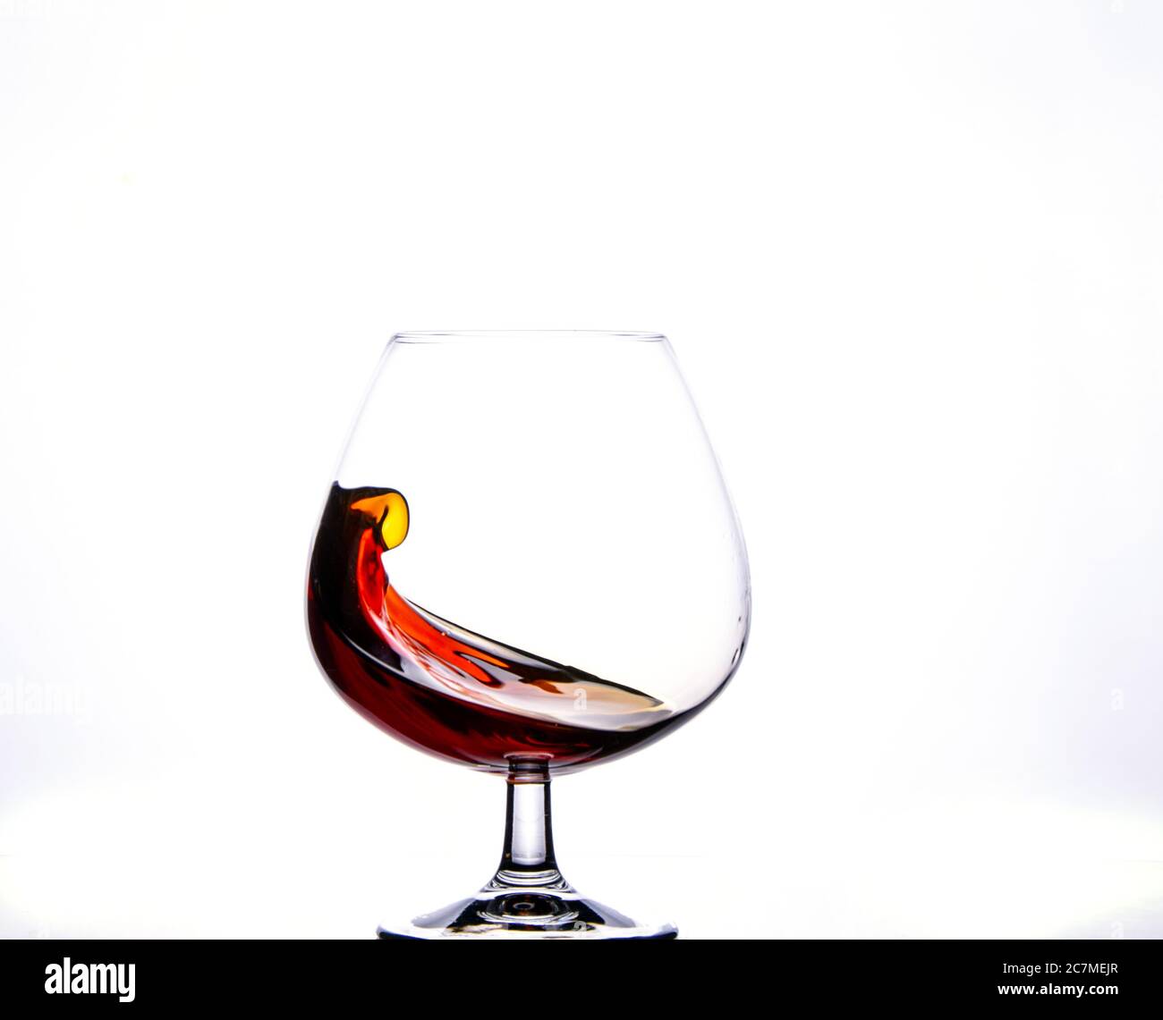 Crystal Glass with Splash of Brandy Stock Photo - Alamy