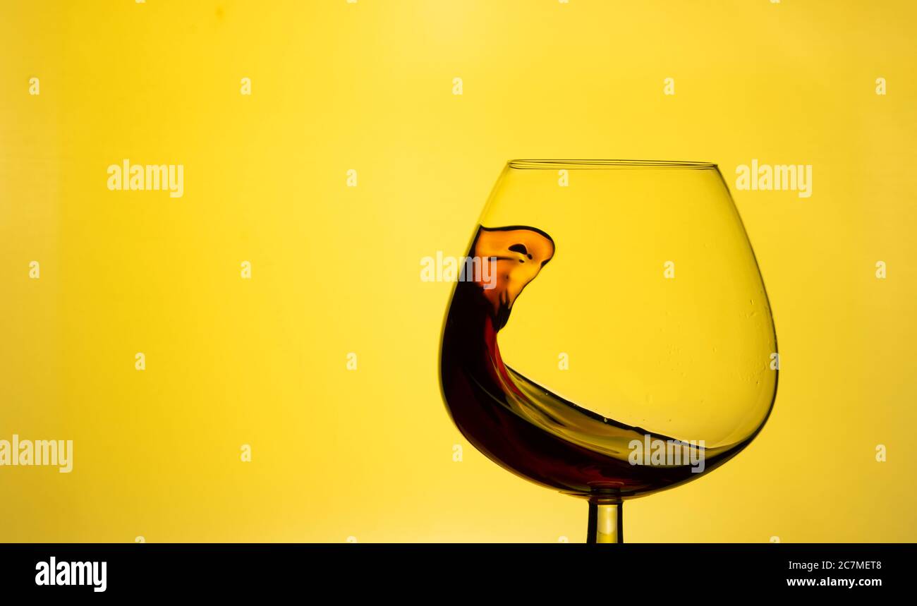 Crystal Glass with Splash of Brandy Stock Photo - Alamy