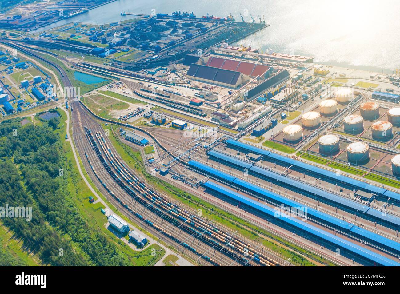 Huge port with oil tanks for storing liquid fuel on the seashore ...