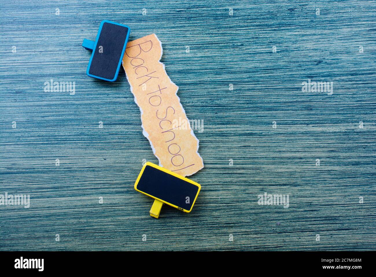Back to school wording on a piece of torn paper Stock Photo - Alamy