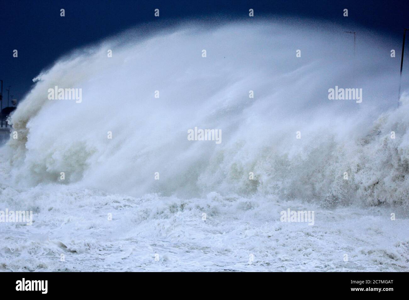 Massive 9m storm waves crashing onto the seawall in Cape Town during an ...