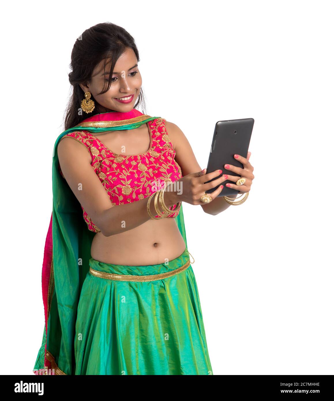 Young Indian traditional girl using a mobile phone or smartphone ...