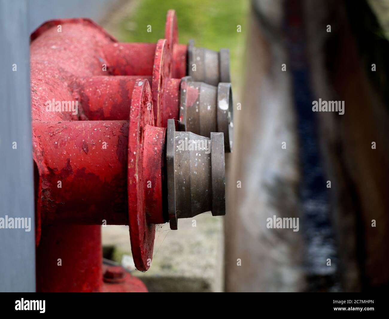 Red color fire extinguisher valves at the bottom of the wall, safety ...
