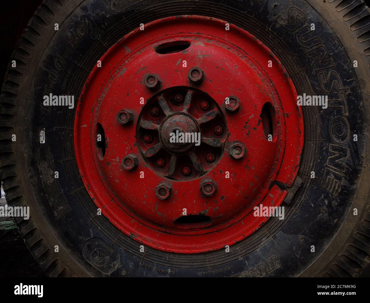 Red rim of a tyre truck resting at a drivers tea spot. These trucks ...