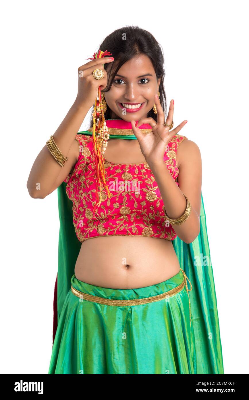 Beautiful Girl Showing Rakhi On Occasion Of Raksha Bandhan On A White Background Sister Tie