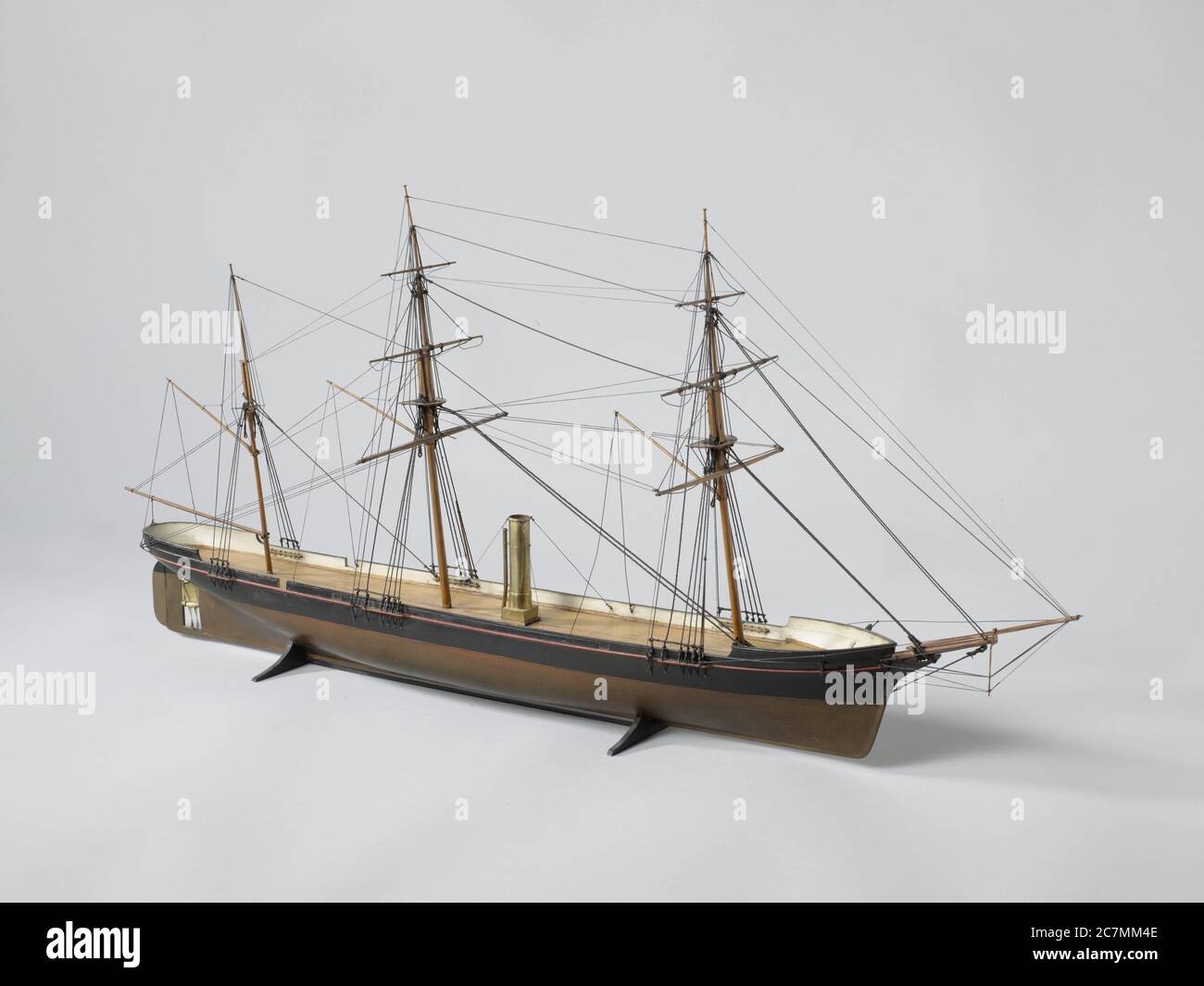 Closeup shot of a small vintage figurine of a ship isolated on a white ...