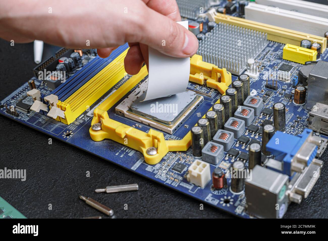 computer motherboard hand smear thermal grease, on the table repair ...