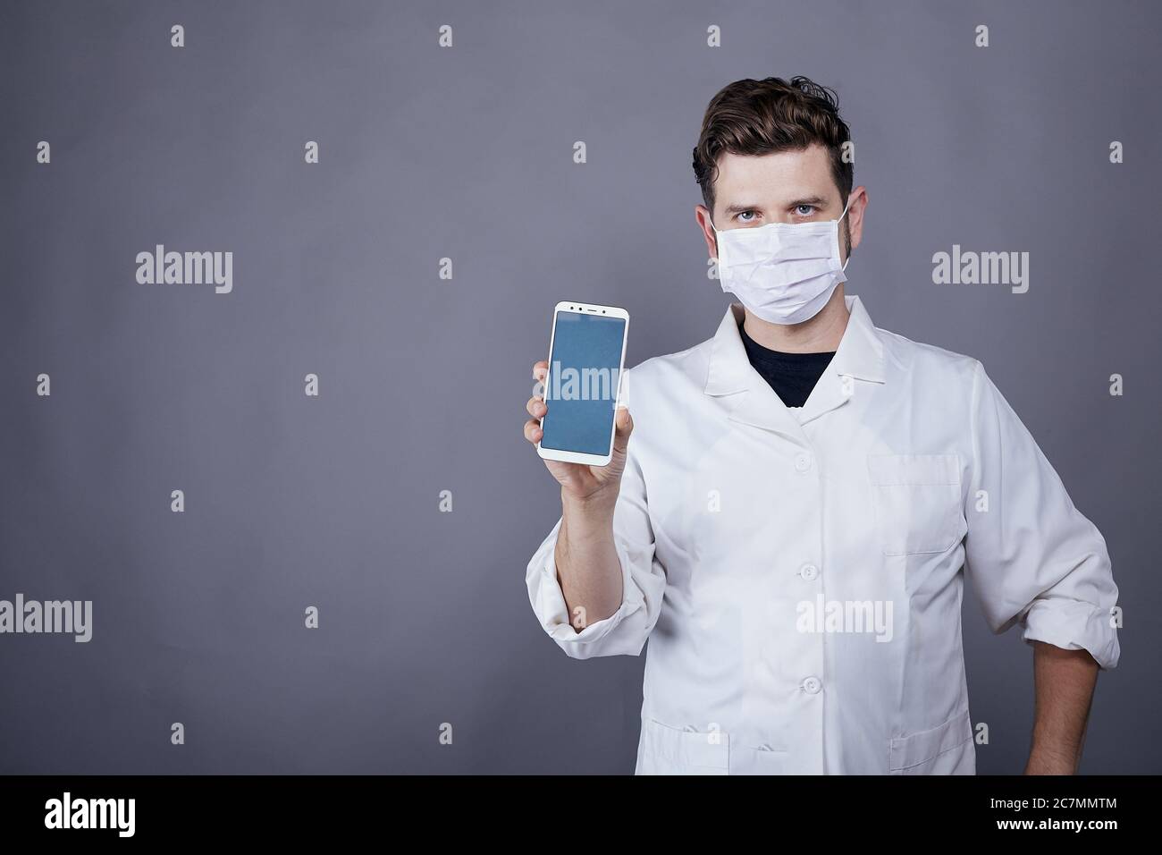 Doctor showing medical face mask hi-res stock photography and images ...