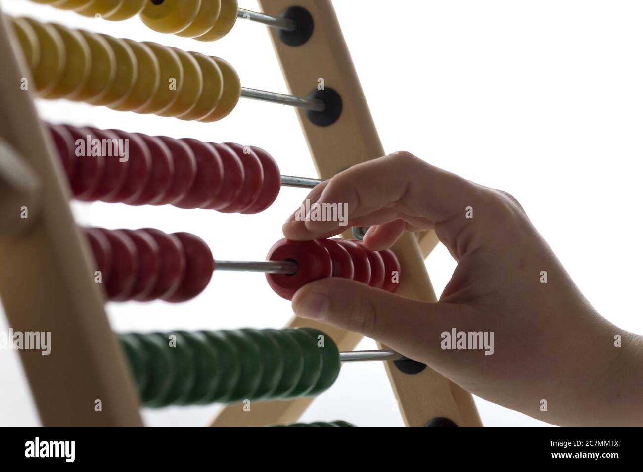 Closeup shot of a child hand used a wooden abacus at home Stock Photo ...