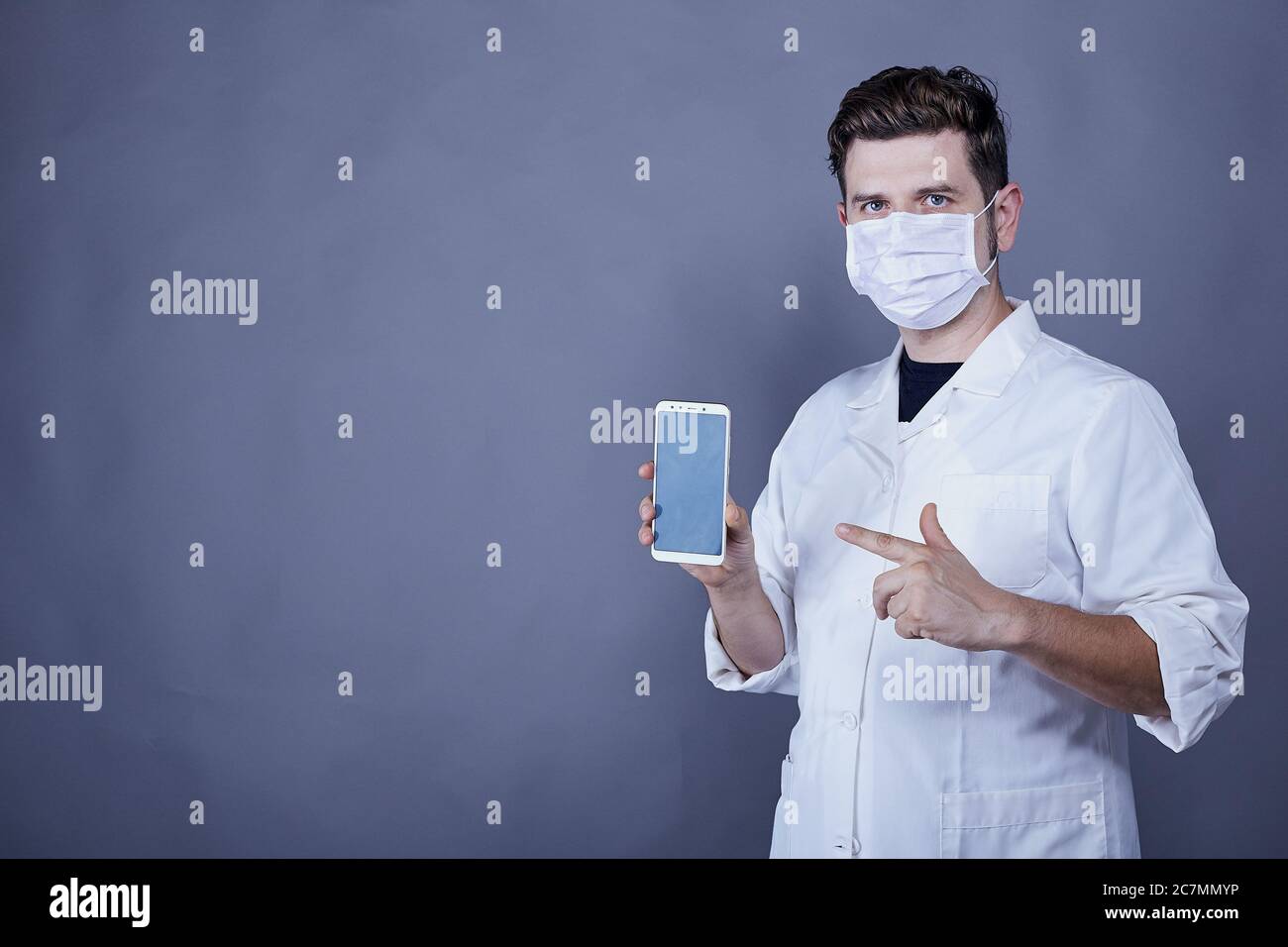 Doctor showing medical face mask hi-res stock photography and images ...