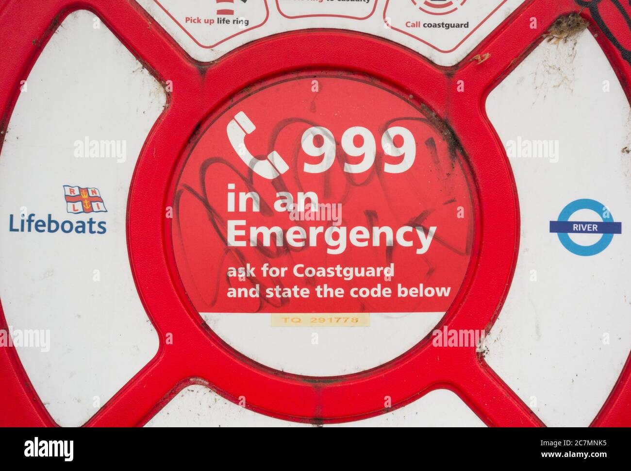 An RNLI LIfeboats LIfe Ring buoyancy aid on the banks of the River ...