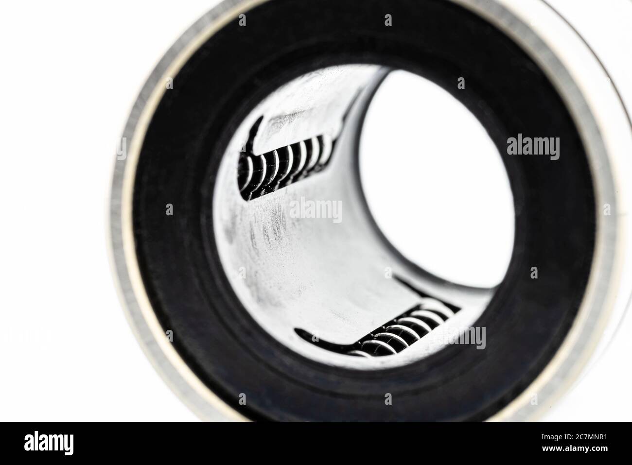 Macro shot of the inside of a linear bearing, isolated on a white ...