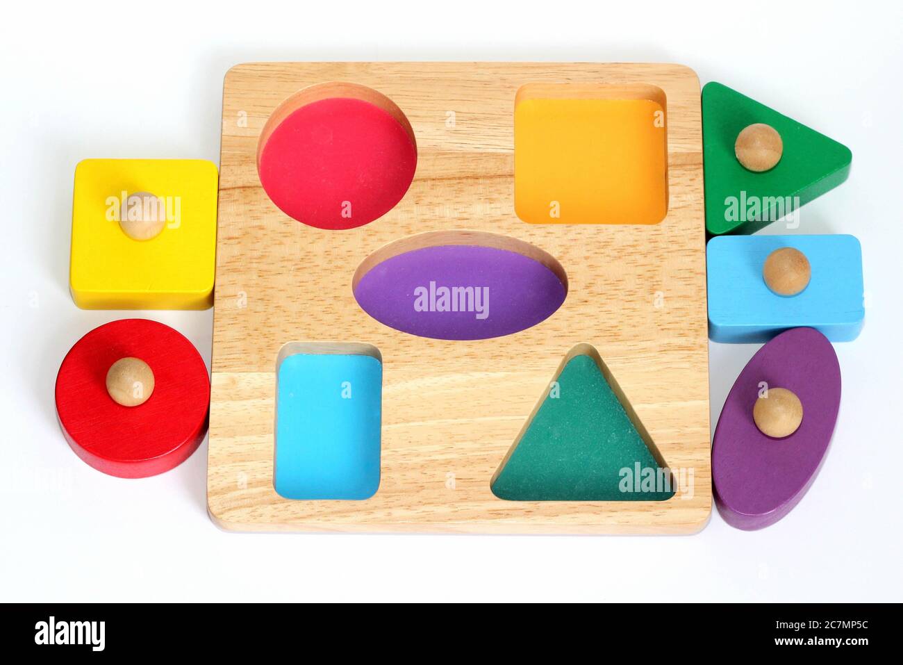 Top view of different wooden shaped blocks on a white background Stock ...