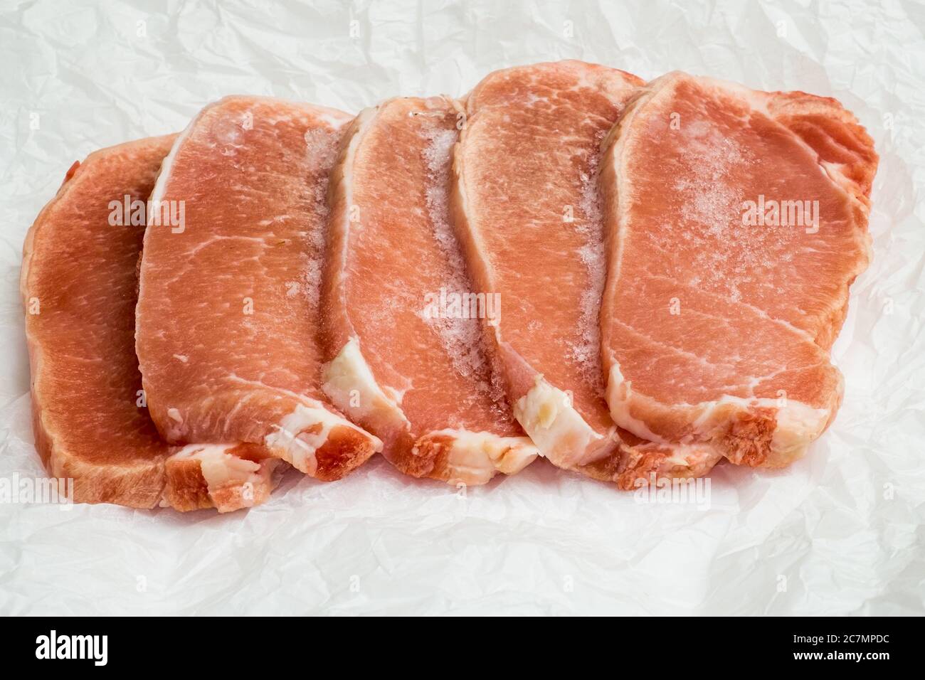 Shot of frozen meat steak on white background Stock Photo - Alamy