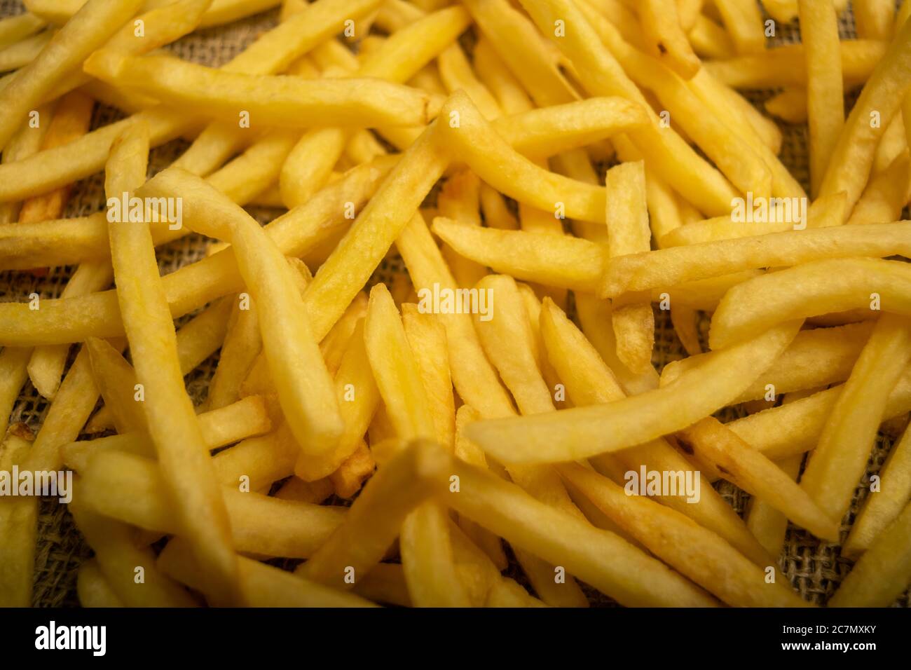 French fries scattered surface texture. Close up Stock Photo - Alamy