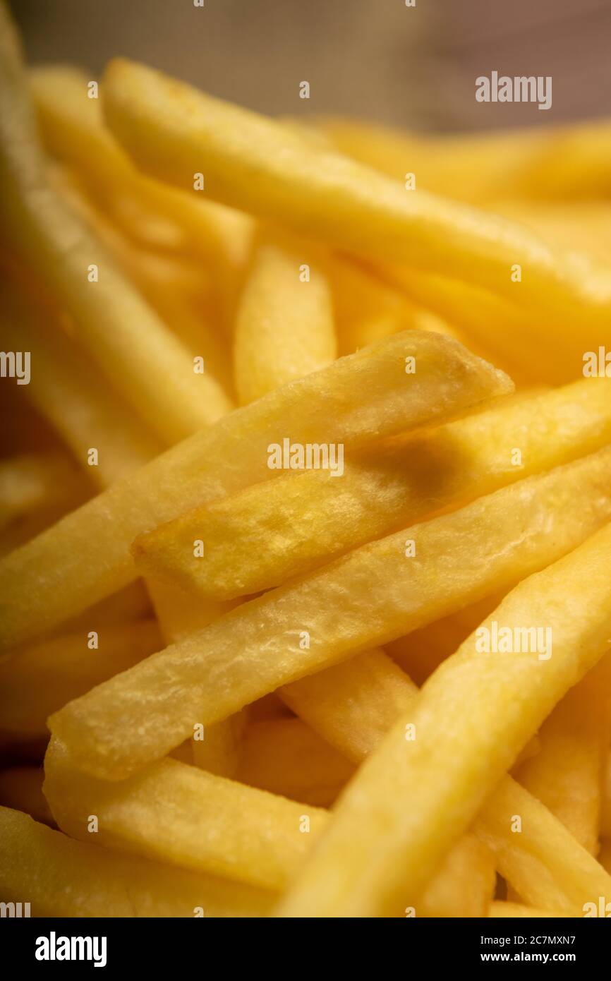 French fries scattered surface texture. Close up Stock Photo - Alamy