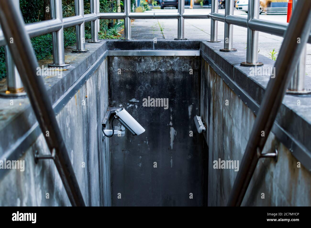 Security camera in an open weathered concreet structure Stock Photo - Alamy