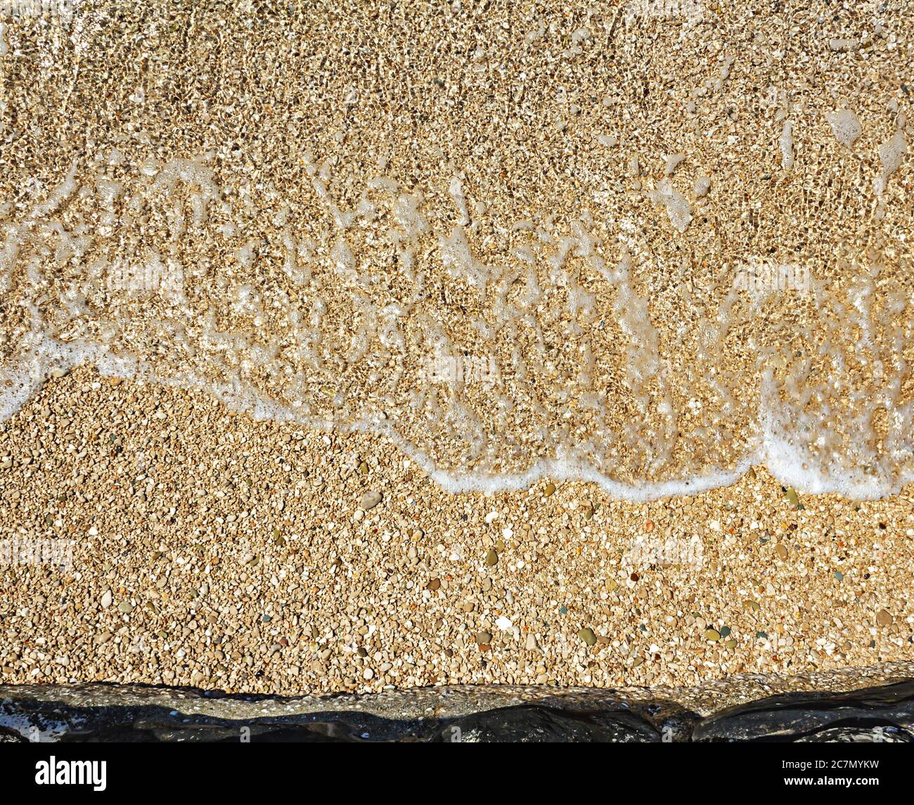 Small-pebble beach with a calm gentle sea of the Adriatic in Croatia ...