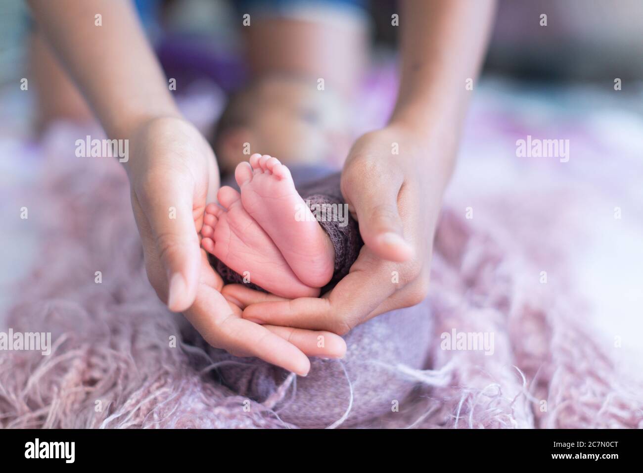 Cradled Baby High Resolution Stock Photography and Images - Alamy